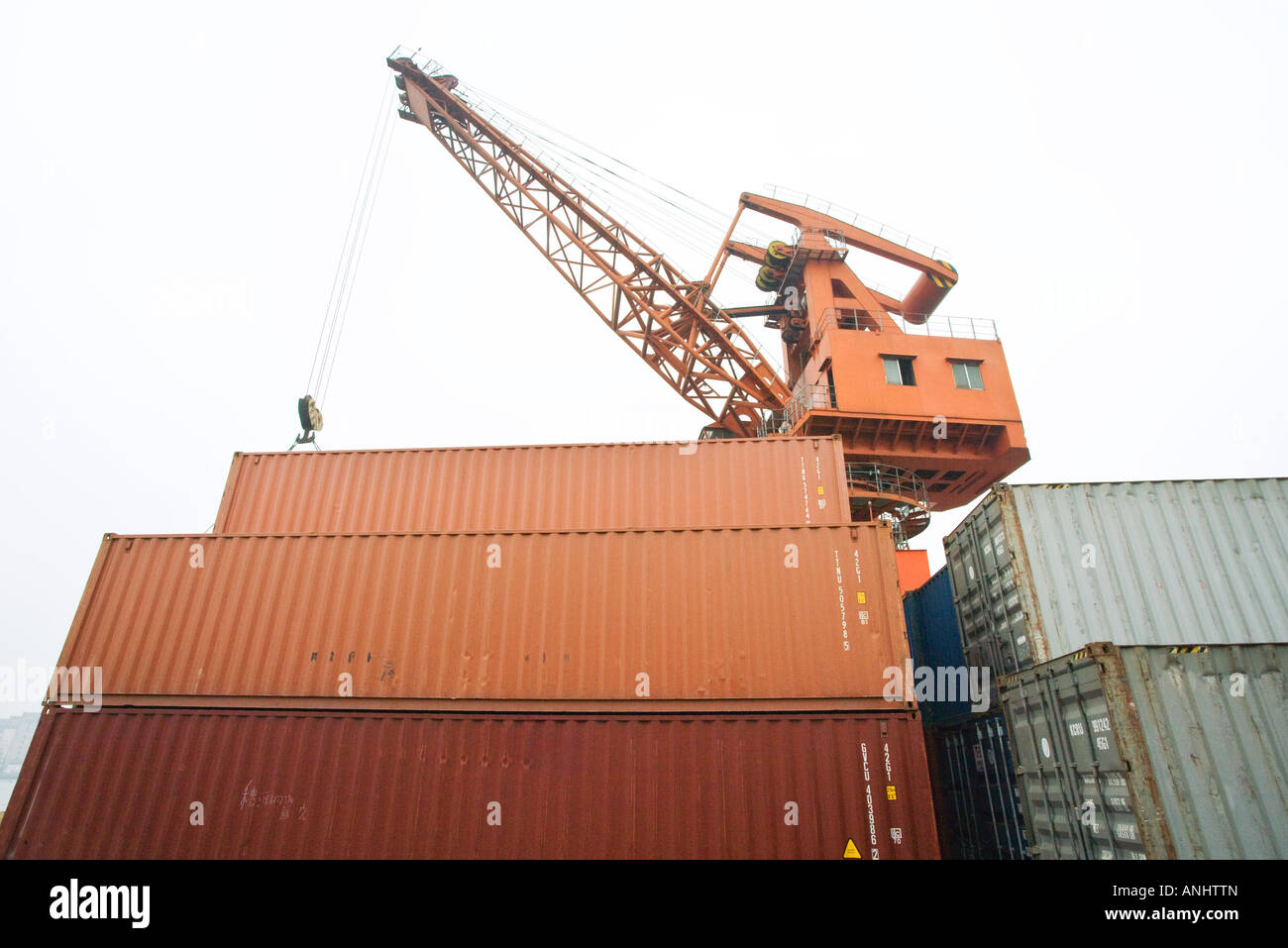 Crane and stack of cargo containers Stock Photo - Alamy