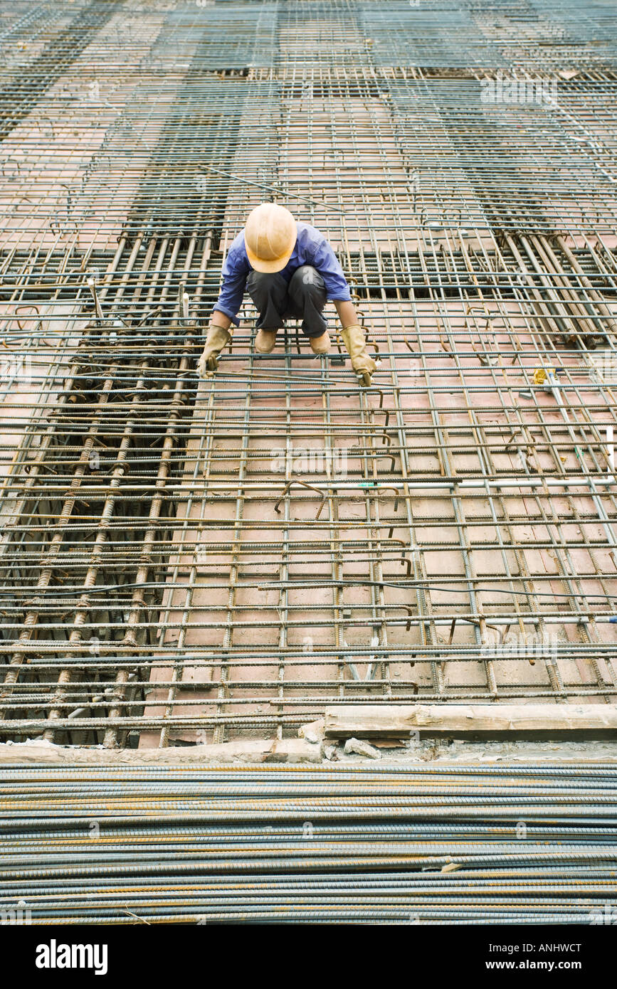 Construction worker working at construction site Stock Photo - Alamy