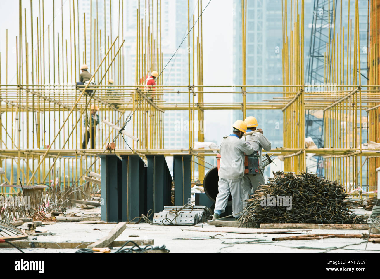 Construction workers working at construction site Stock Photo - Alamy