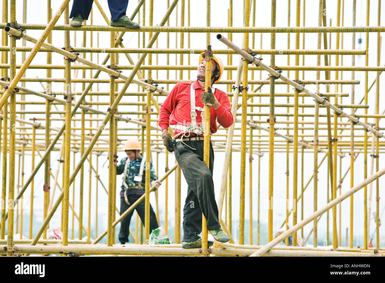 Construction workers working at construction site Stock Photo - Alamy