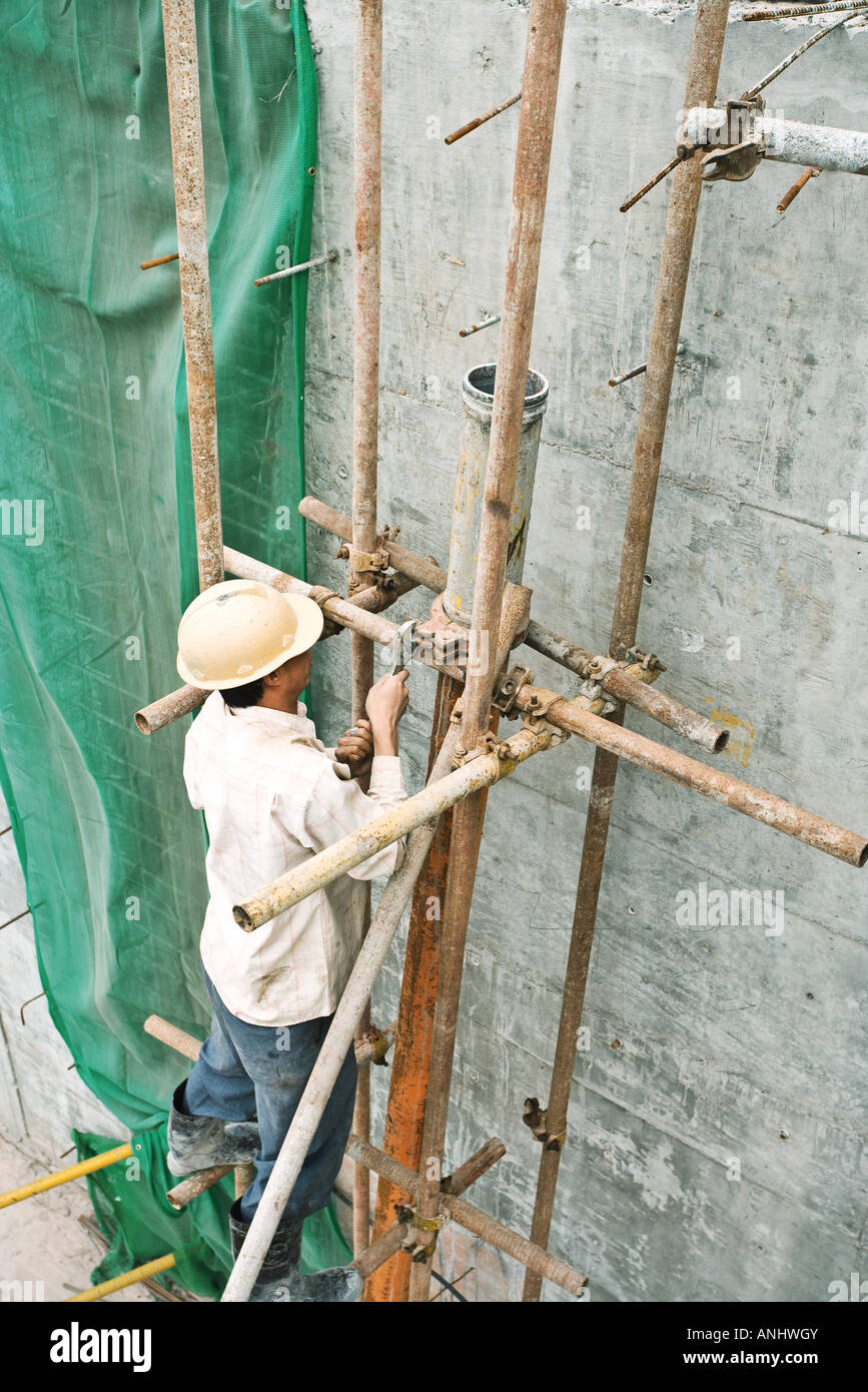 Construction worker working at construction site Stock Photo - Alamy