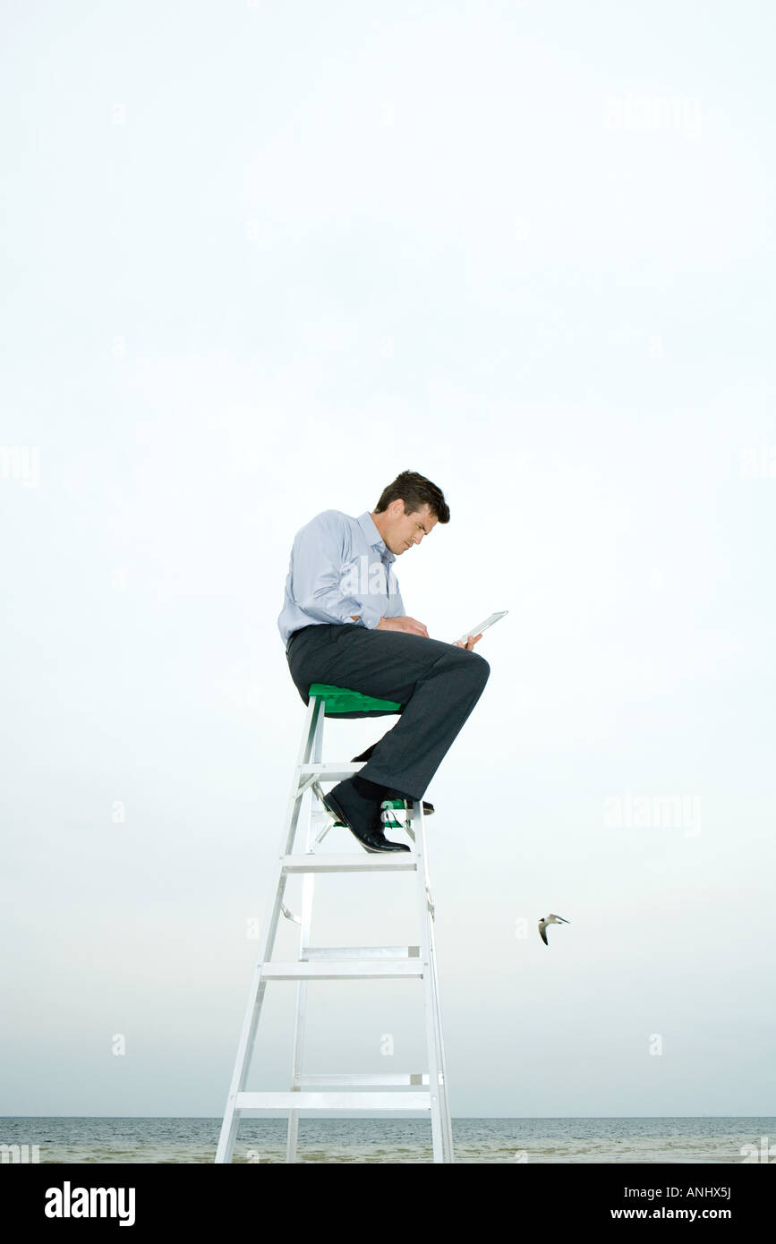 Man on ladder colour background hi-res stock photography and images - Alamy