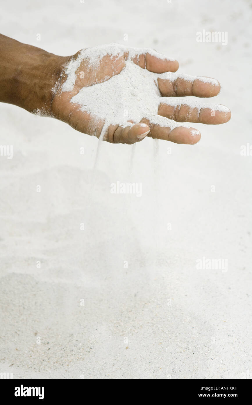Man hands holding spilling sand hi-res stock photography and images - Alamy