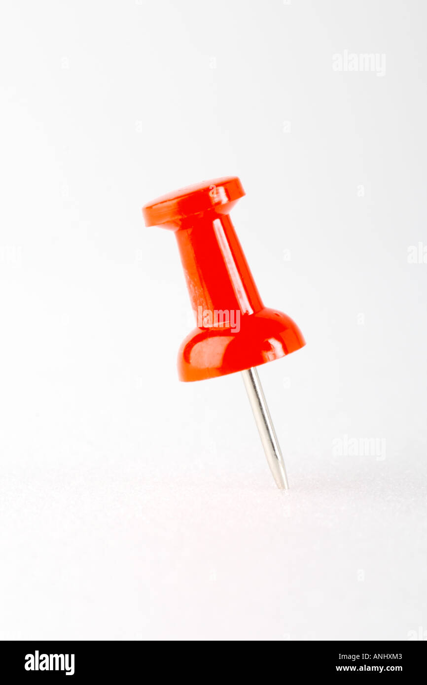 A thumbtack stuck in a board Stock Photo - Alamy