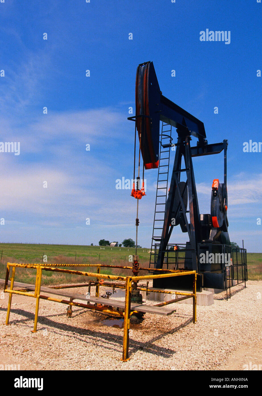 Pump-jack. Isolated crude oil pump jack. Climate change. Hydraulic fracking machinery in Texas ...