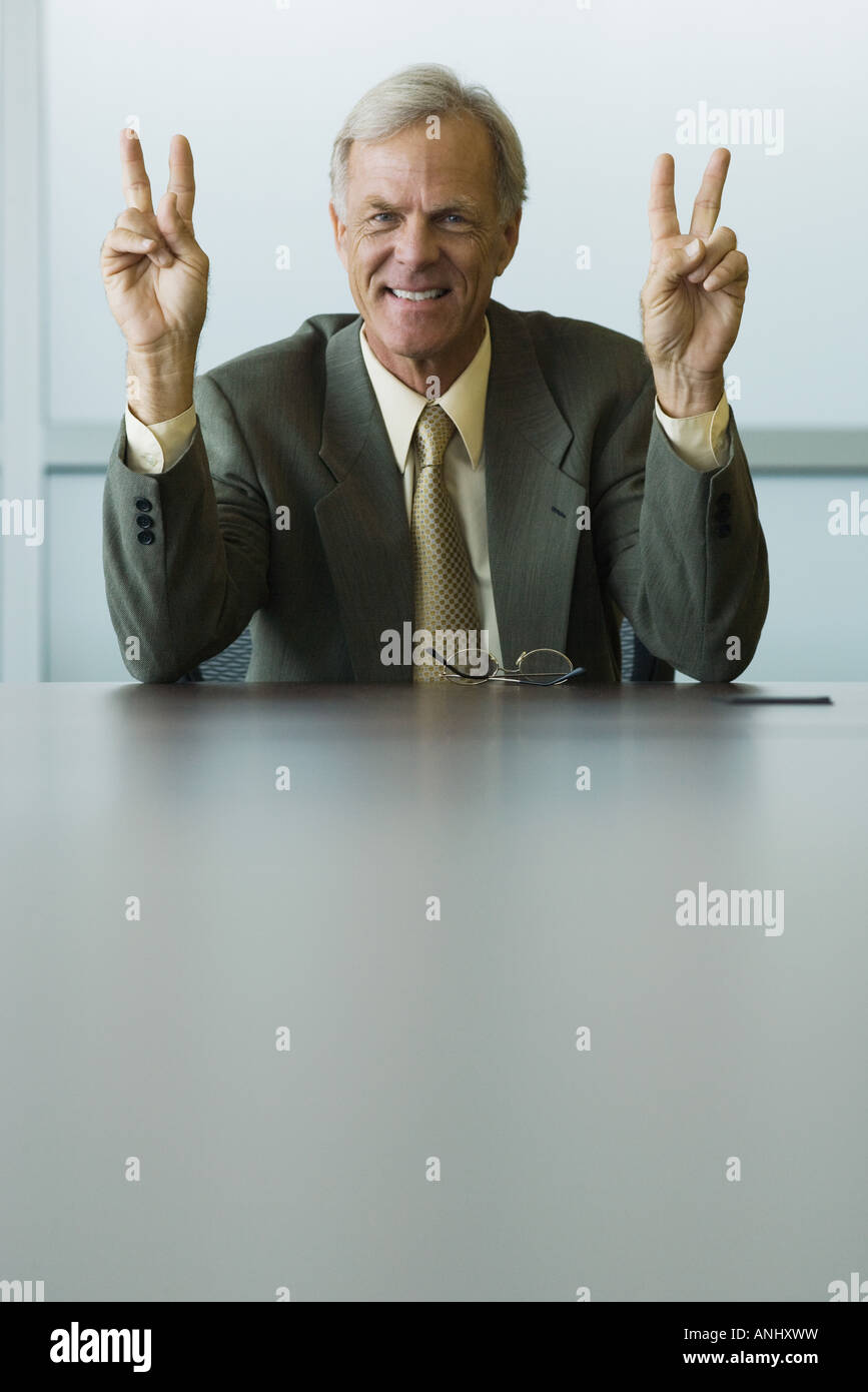 Man making peace signs hi-res stock photography and images - Alamy