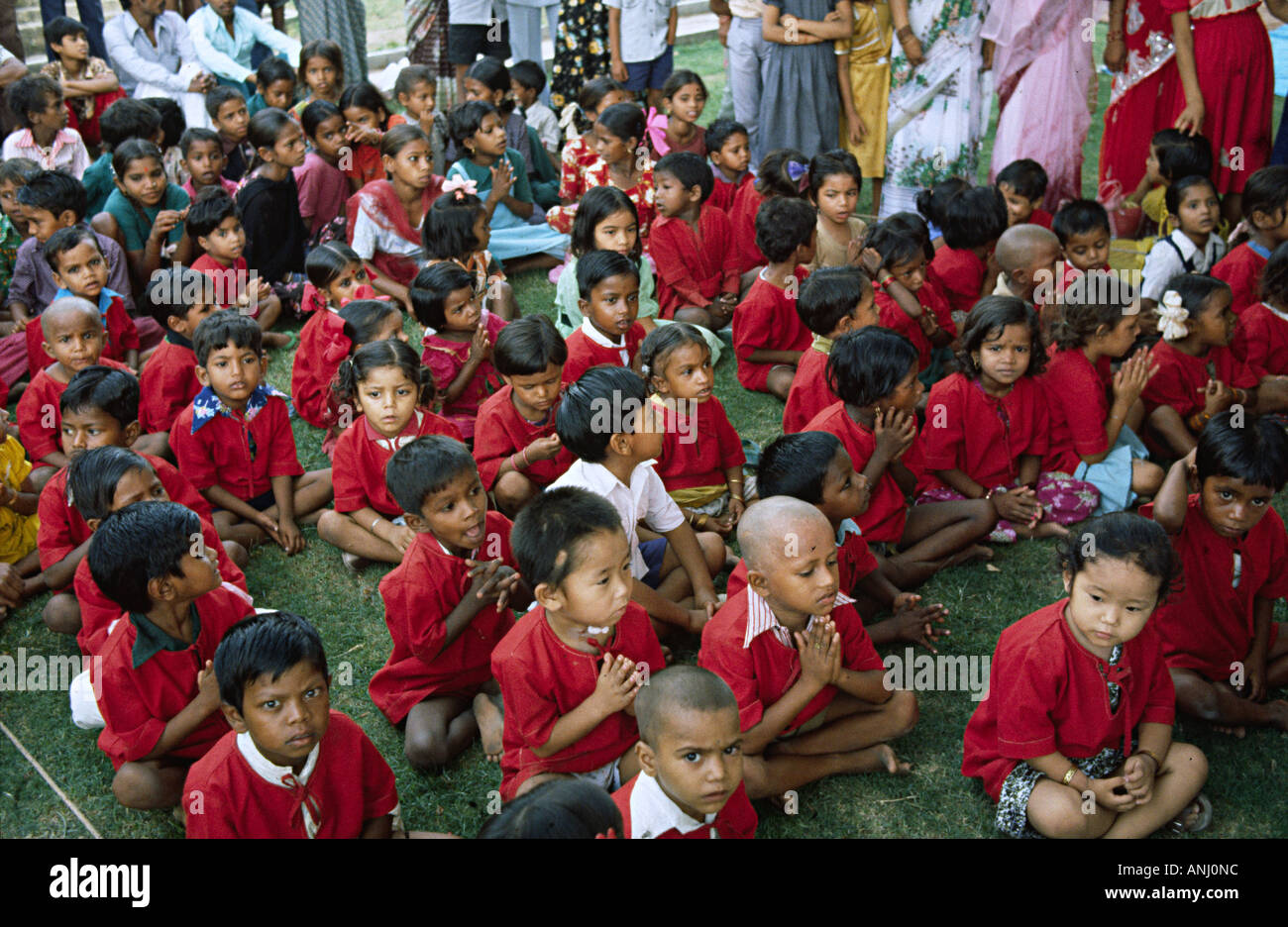The many faces of Indian children from Buddhist families at a puja in ...