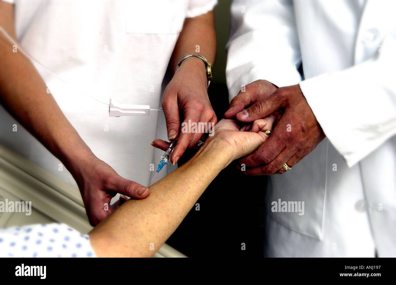 Nurse setting up an IV Stock Photo - Alamy