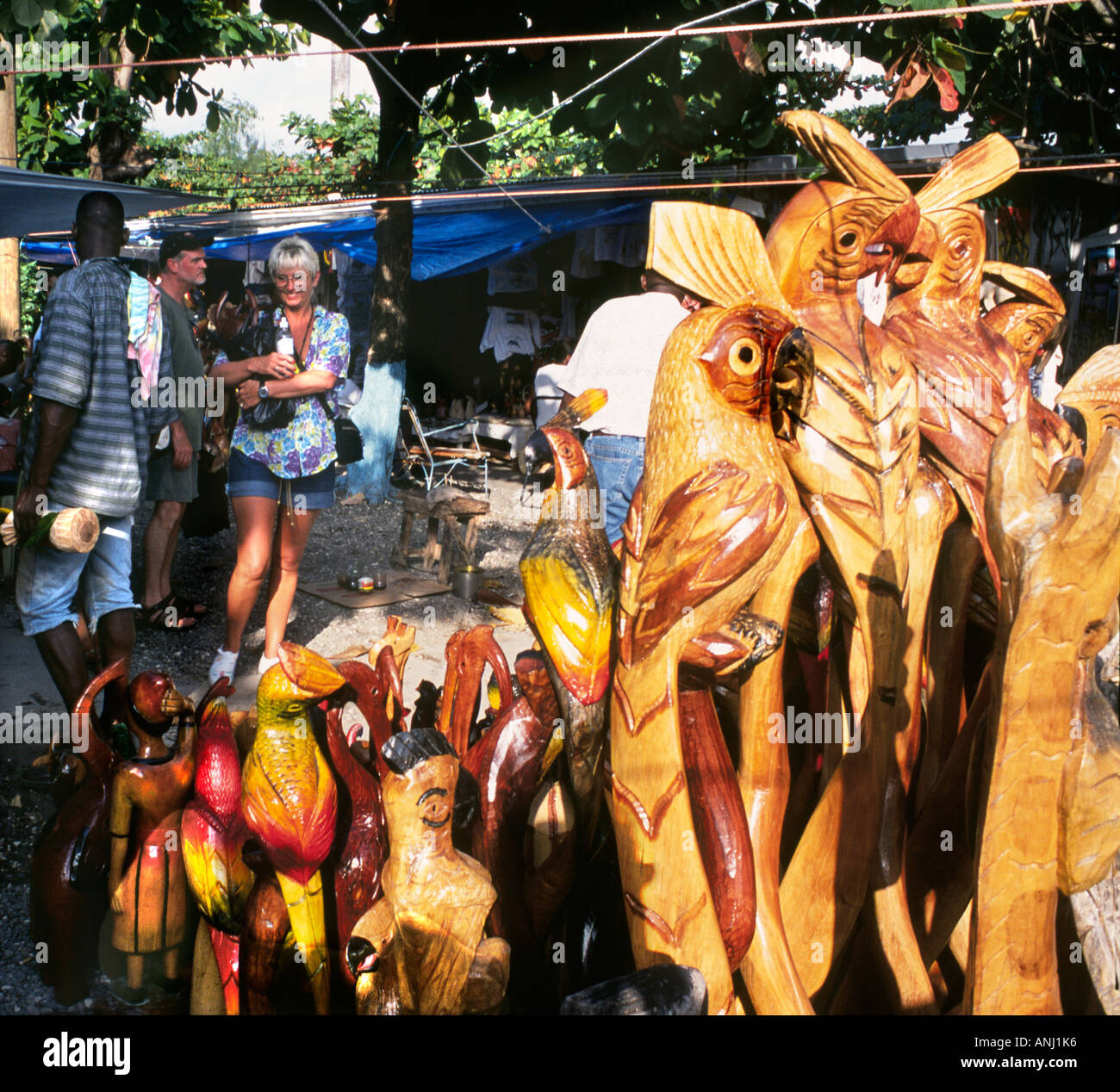 Carved wooden tropical birds at the Ochos Rios straw market in Jamaica ...