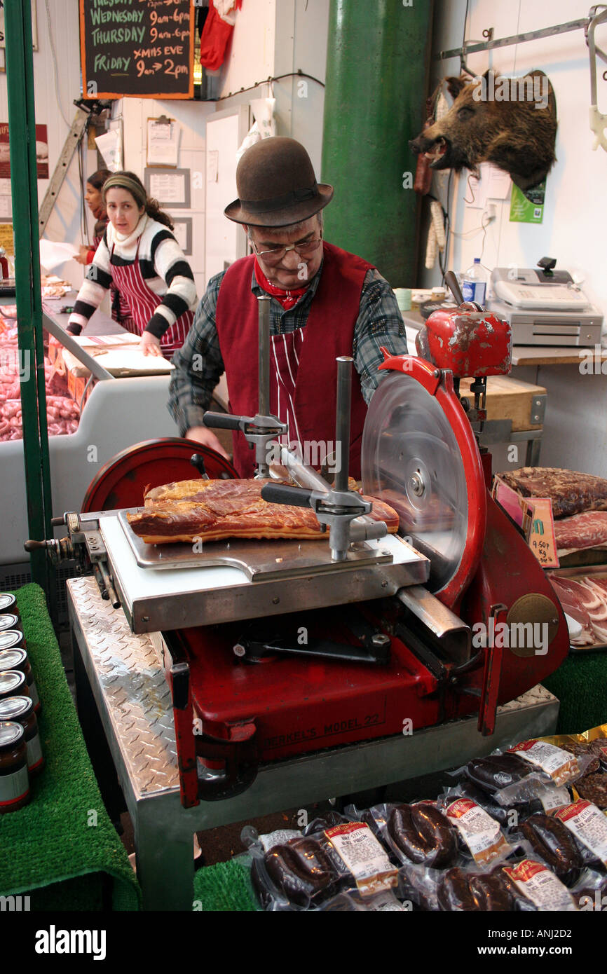 Butcher carving ham at Borough market London Stock Photo - Alamy