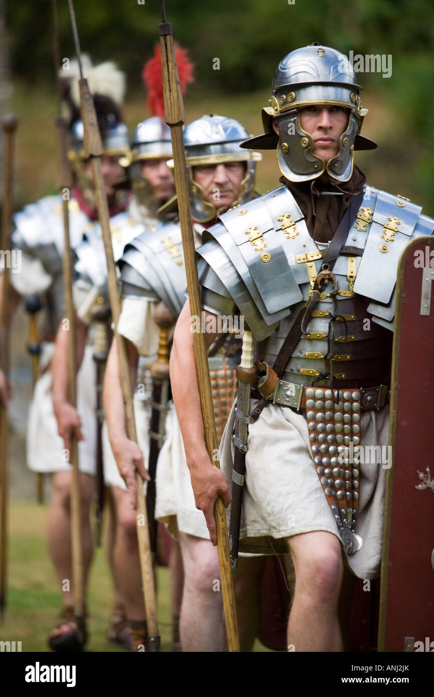 Roman soldiers marching with shields and weaponry at a Roman army ...