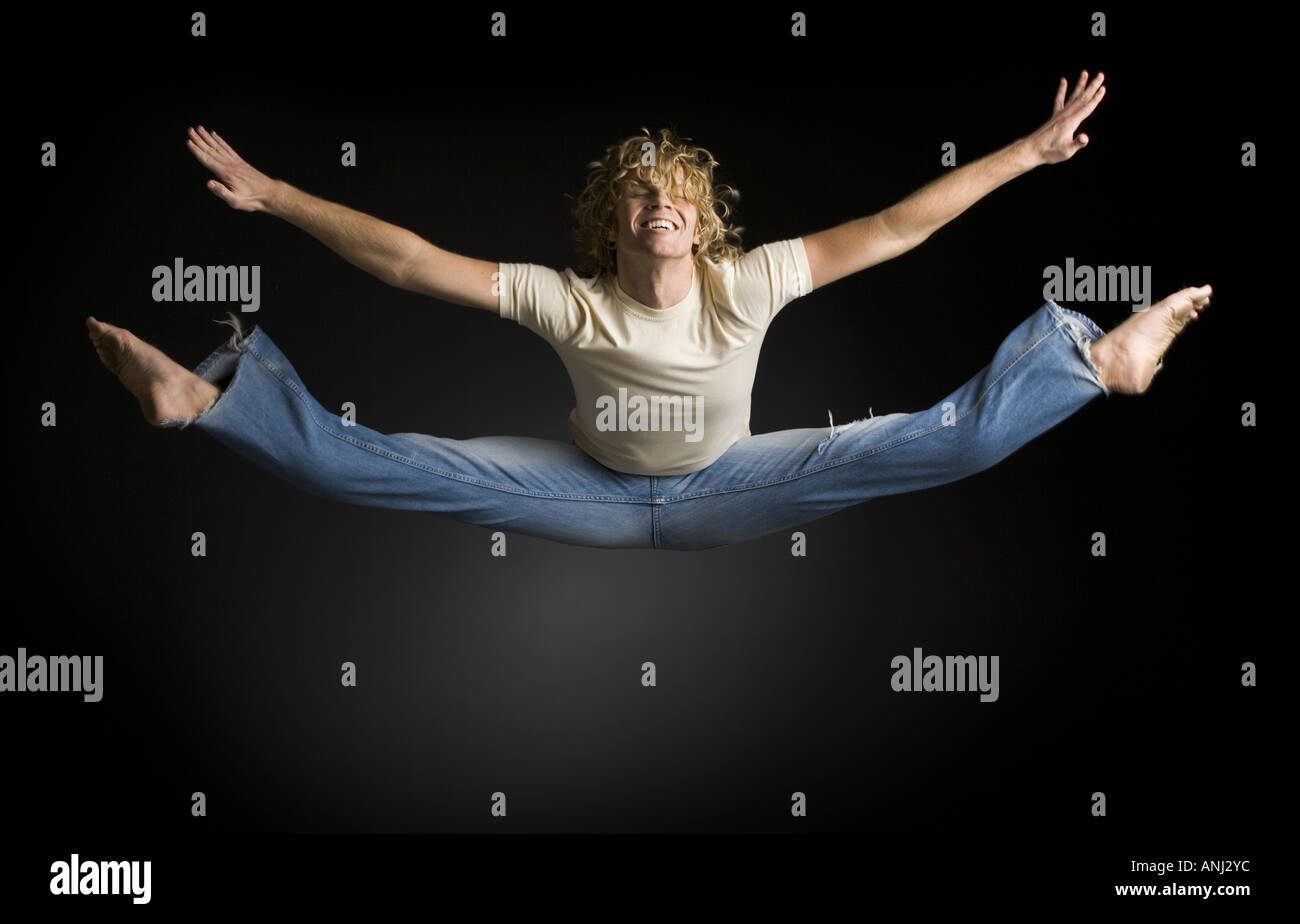 Young man jumping doing splits hi-res stock photography and images - Alamy
