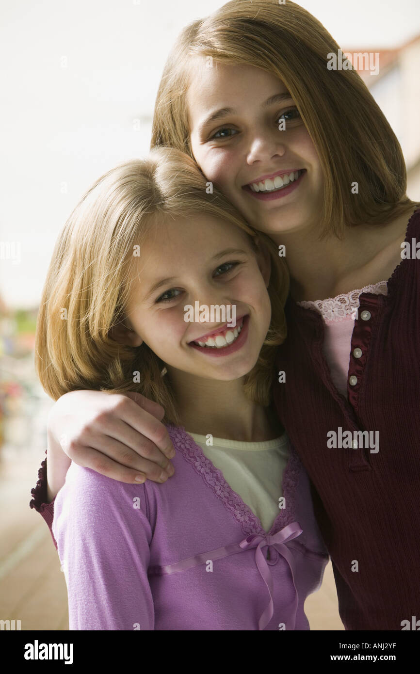 Portrait of two sisters smiling Stock Photo - Alamy