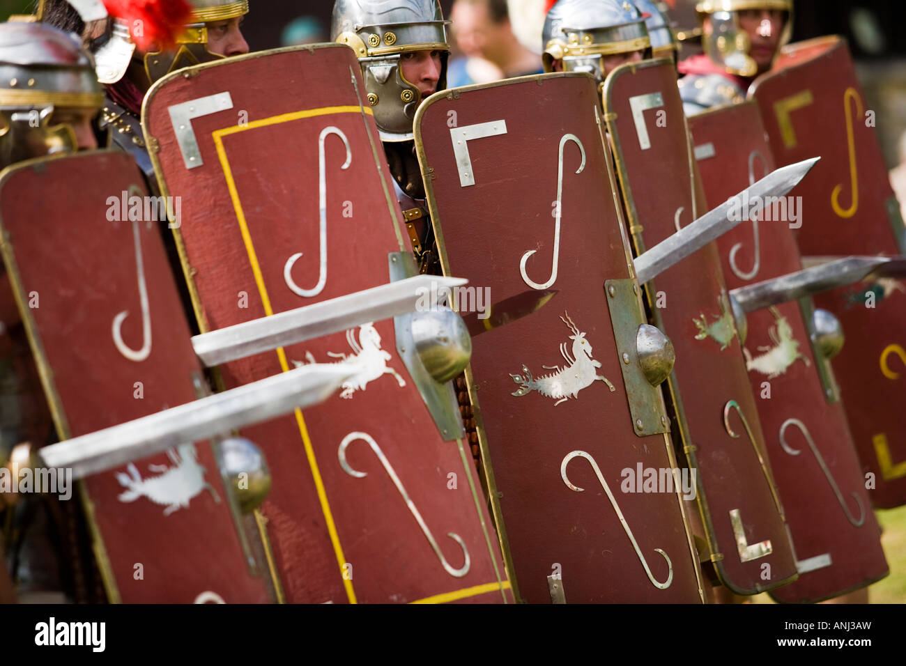 Roman soldiers in formation with shields and weaponry at a Roman army ...
