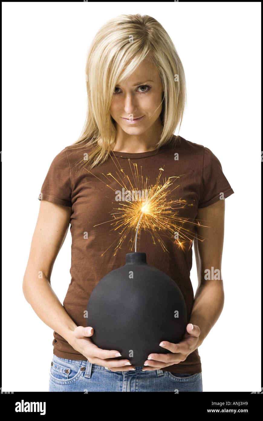 Portrait of a young woman holding a bomb Stock Photo - Alamy