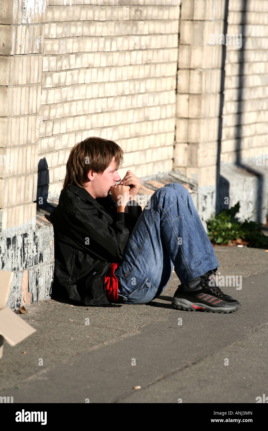 Sitting against a wall hi-res stock photography and images - Alamy