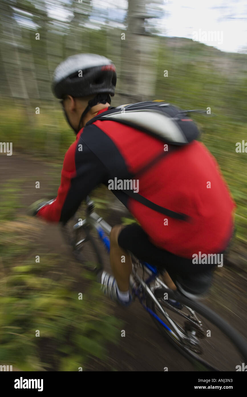 Profile of a mature man mountain biking Stock Photo - Alamy