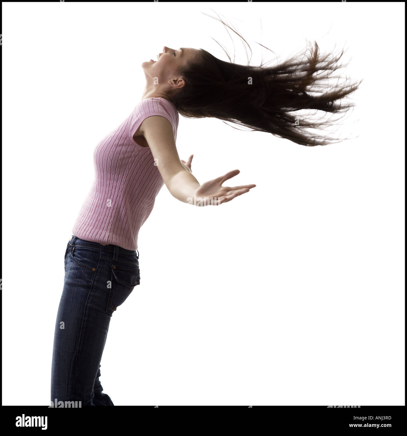 Young woman laughing with her arms outstretched Stock Photo - Alamy