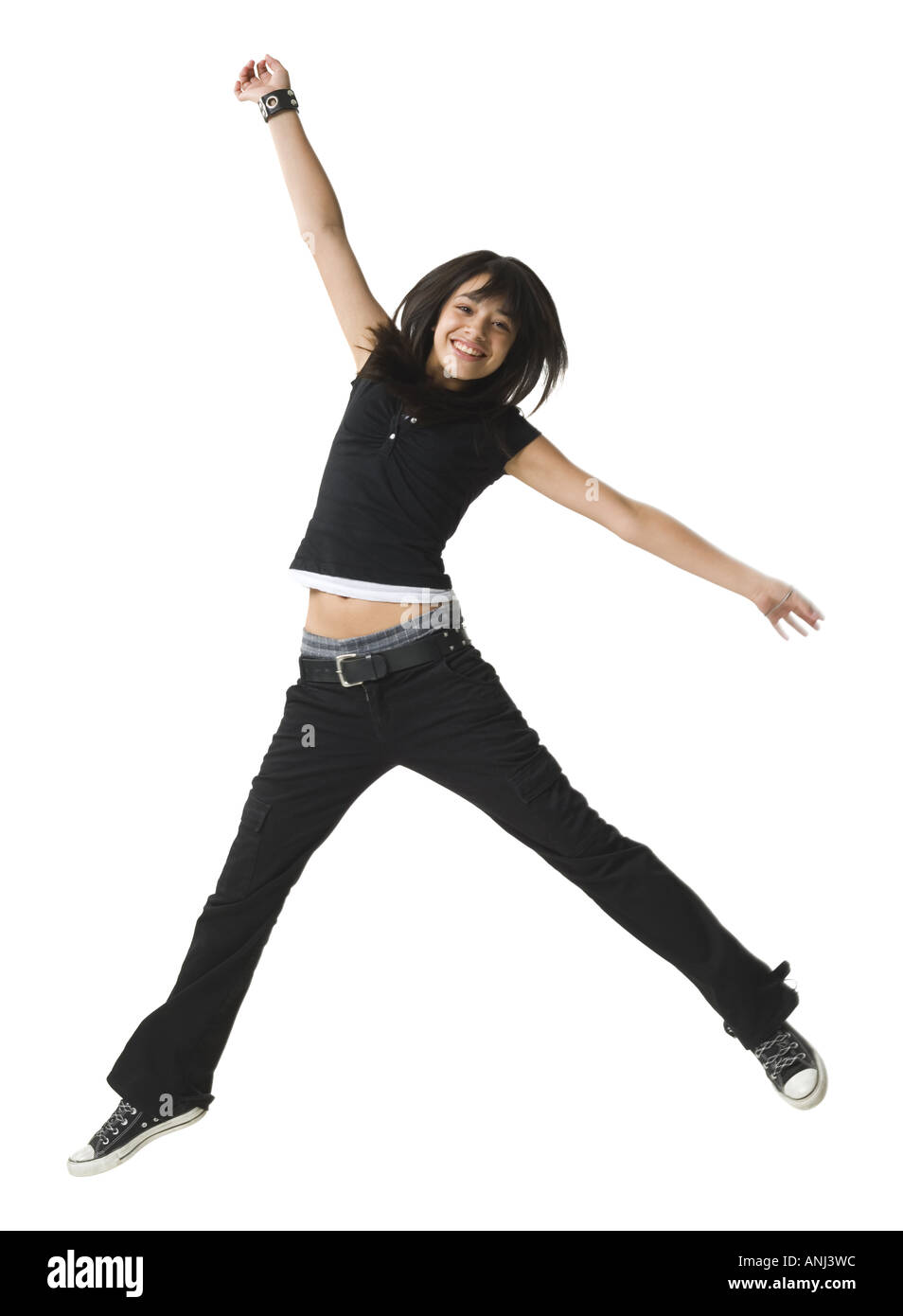 Teenage girl jumping with her arm outstretched Stock Photo - Alamy