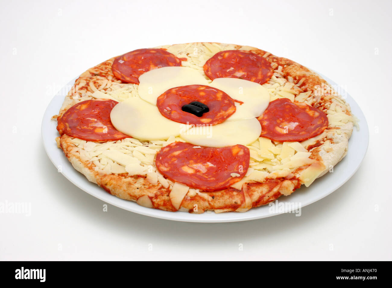 Pepperoni pizza uncooked Stock Photo - Alamy