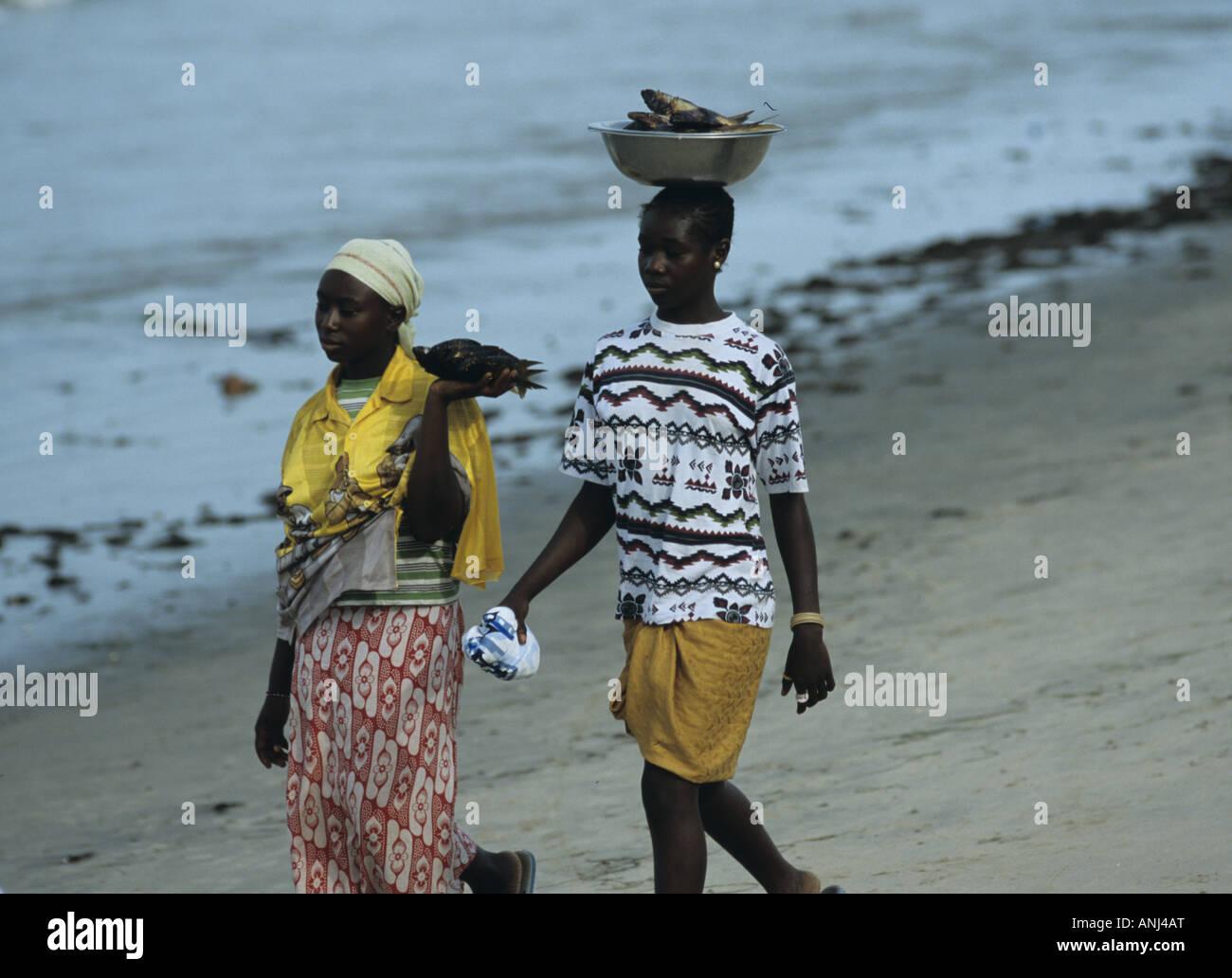 Women carry fish hi-res stock photography and images - Alamy