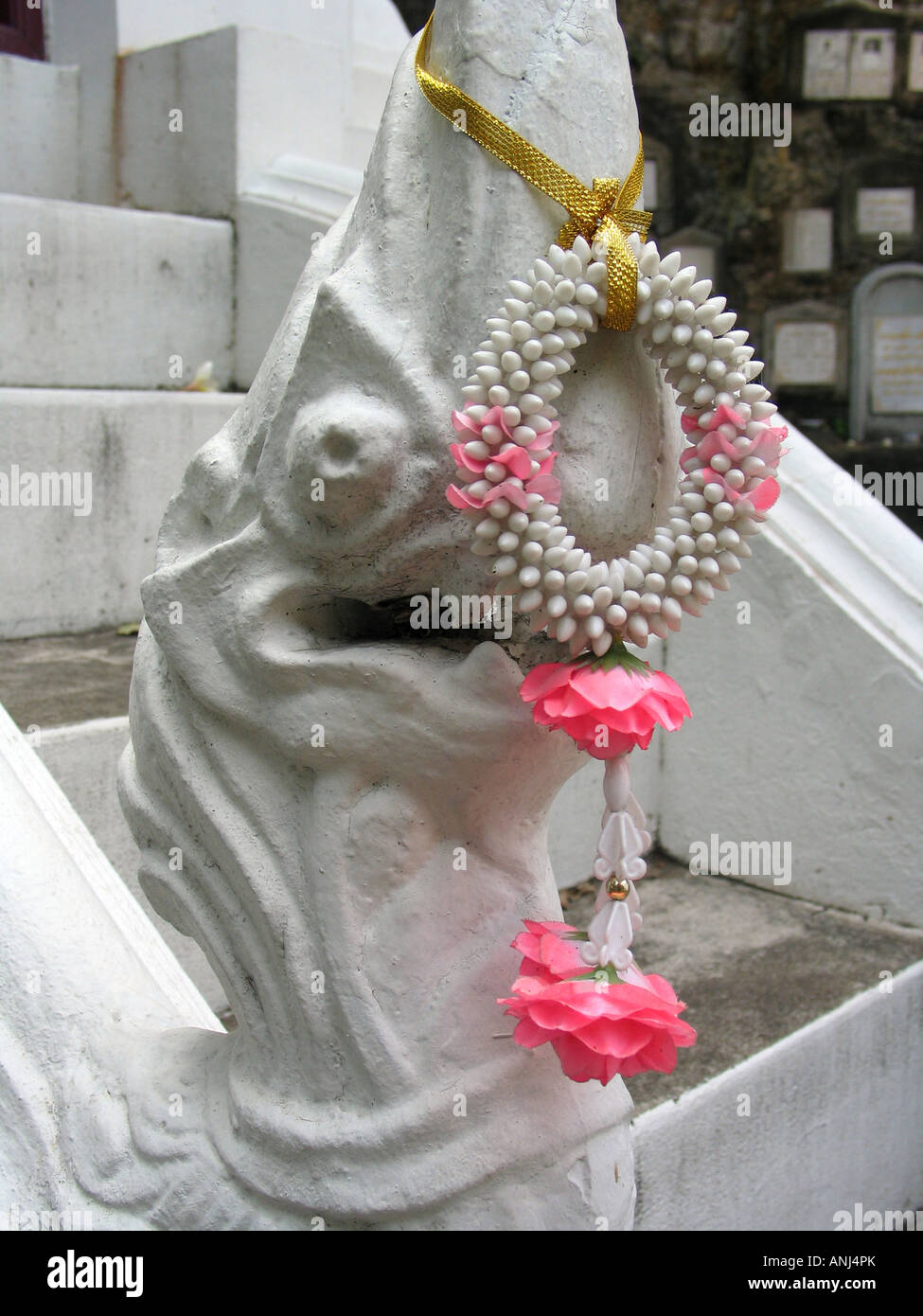 Pink flower garland at a Buddhist temple in Thailand Stock Photo - Alamy