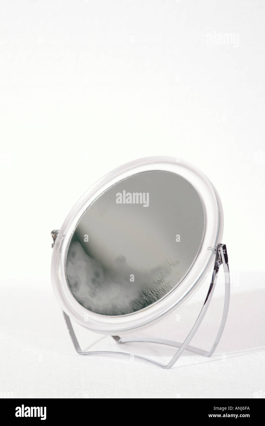 round mirror partially steamed Stock Photo - Alamy