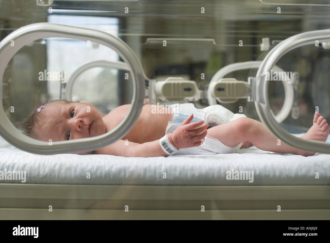 Newborn Baby Boy In Incubator Premature Baby's Cuddle 'saved Twin