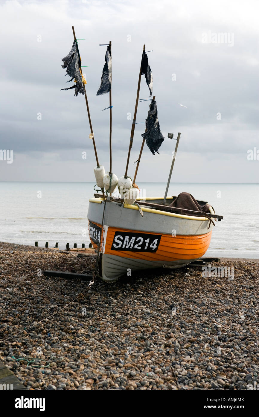 Fishing boat on a pebble beach Worthing Sussex England UK Stock Photo ...