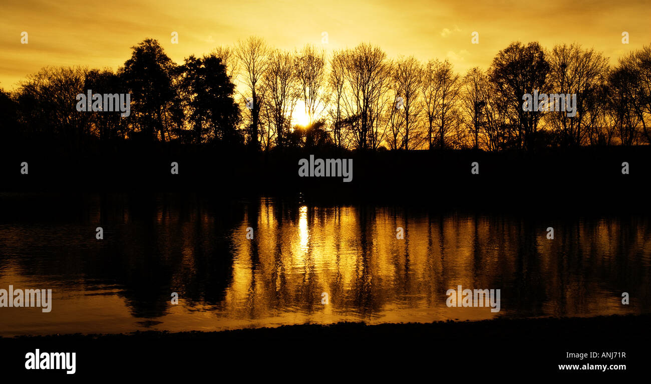 A beautiful sunset over a lake Stock Photo - Alamy