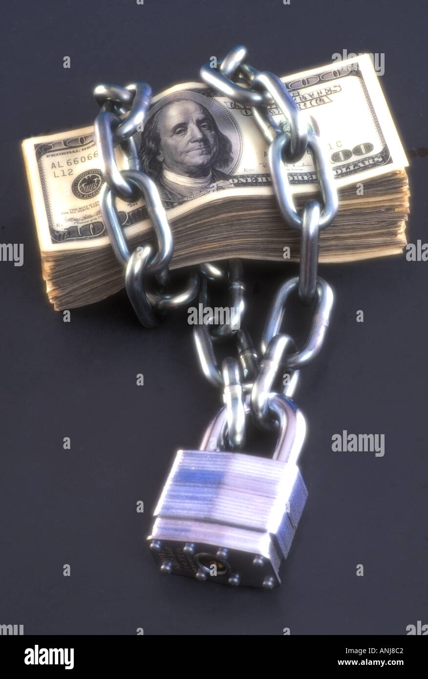 chain and padlock with stack of one dollar bills US Stock Photo - Alamy