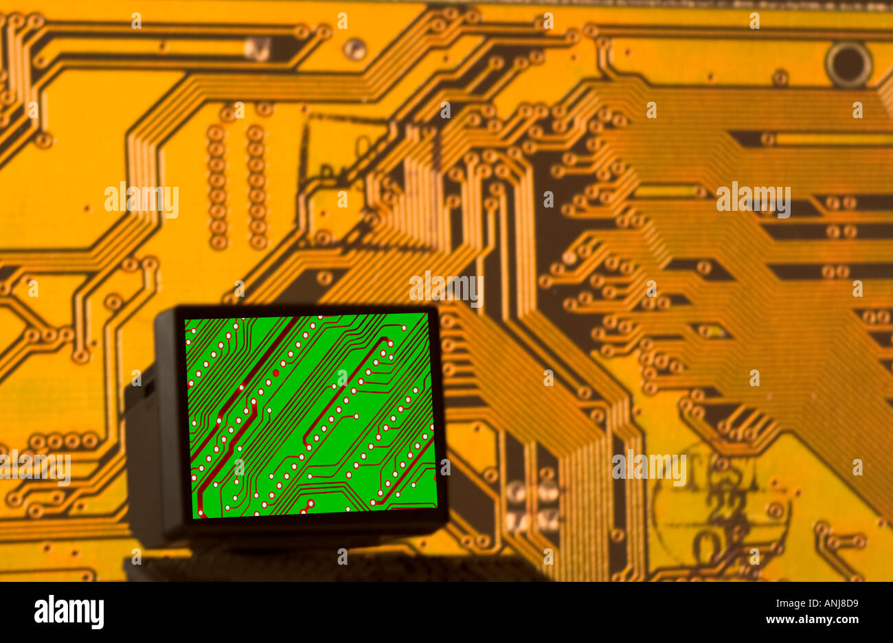 computer monitor with circuit board image on screen and background ...