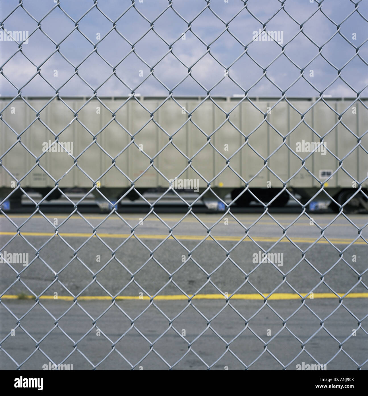 train behind fence Stock Photo - Alamy