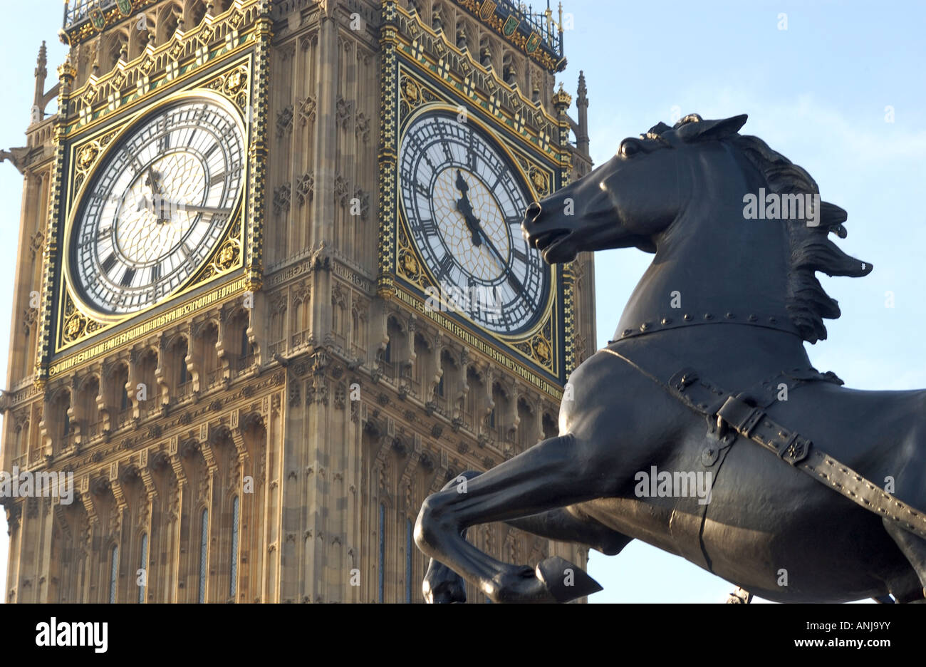 Clock tower (Big Ben) at the Palace of Westminster with bronze statue ...