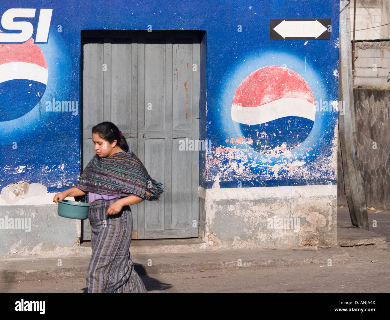 Logos and traditional dress contrast Stock Photo - Alamy