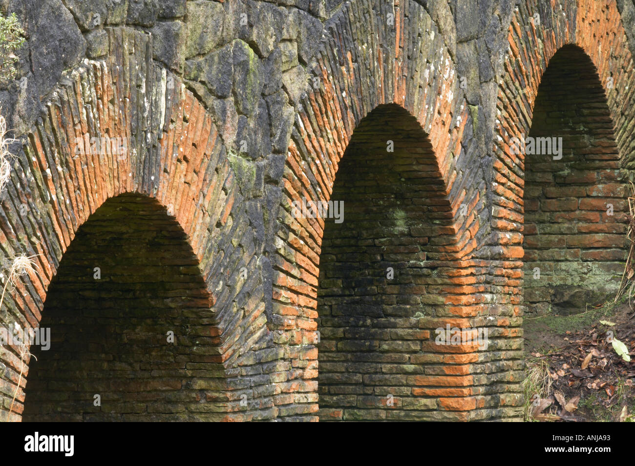 Details of lichen encrusted stone bridge in Japanese Gardens Rivington ...