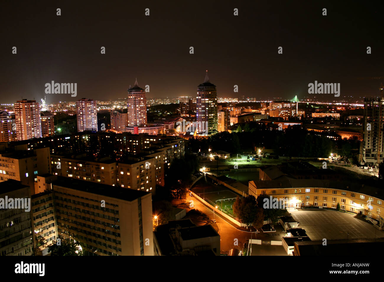 Night skyline of Kyiv with illuminated high-rise buildings and city ...