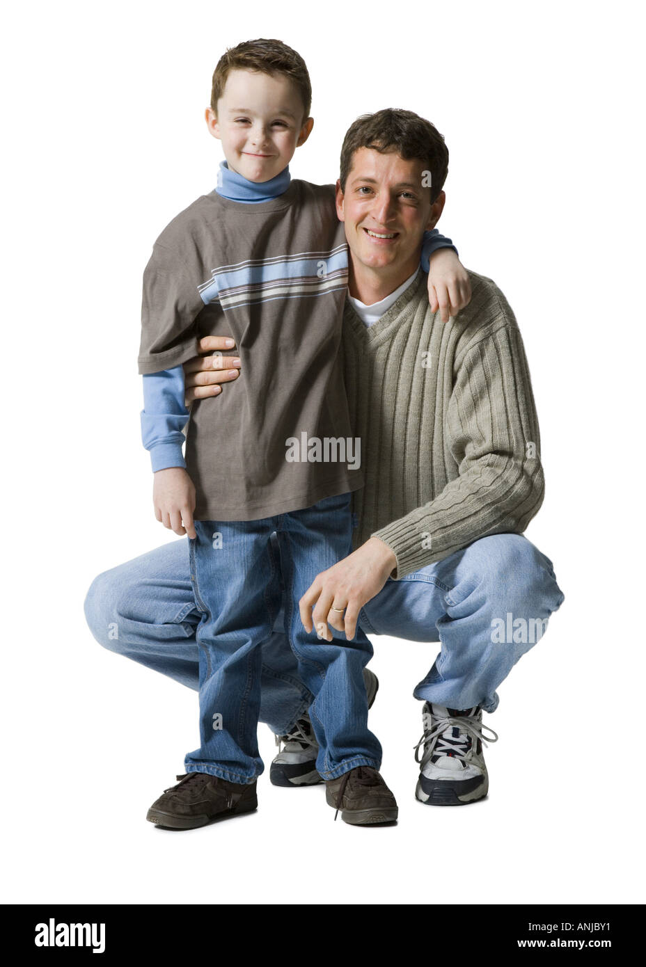 Portrait of a father and his son with their arms around each other ...
