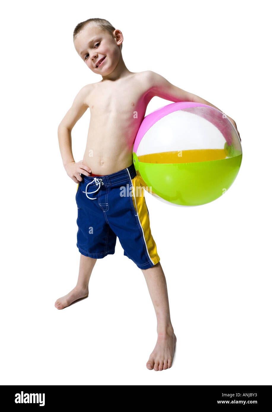 Portrait of a boy holding a beach ball Stock Photo - Alamy
