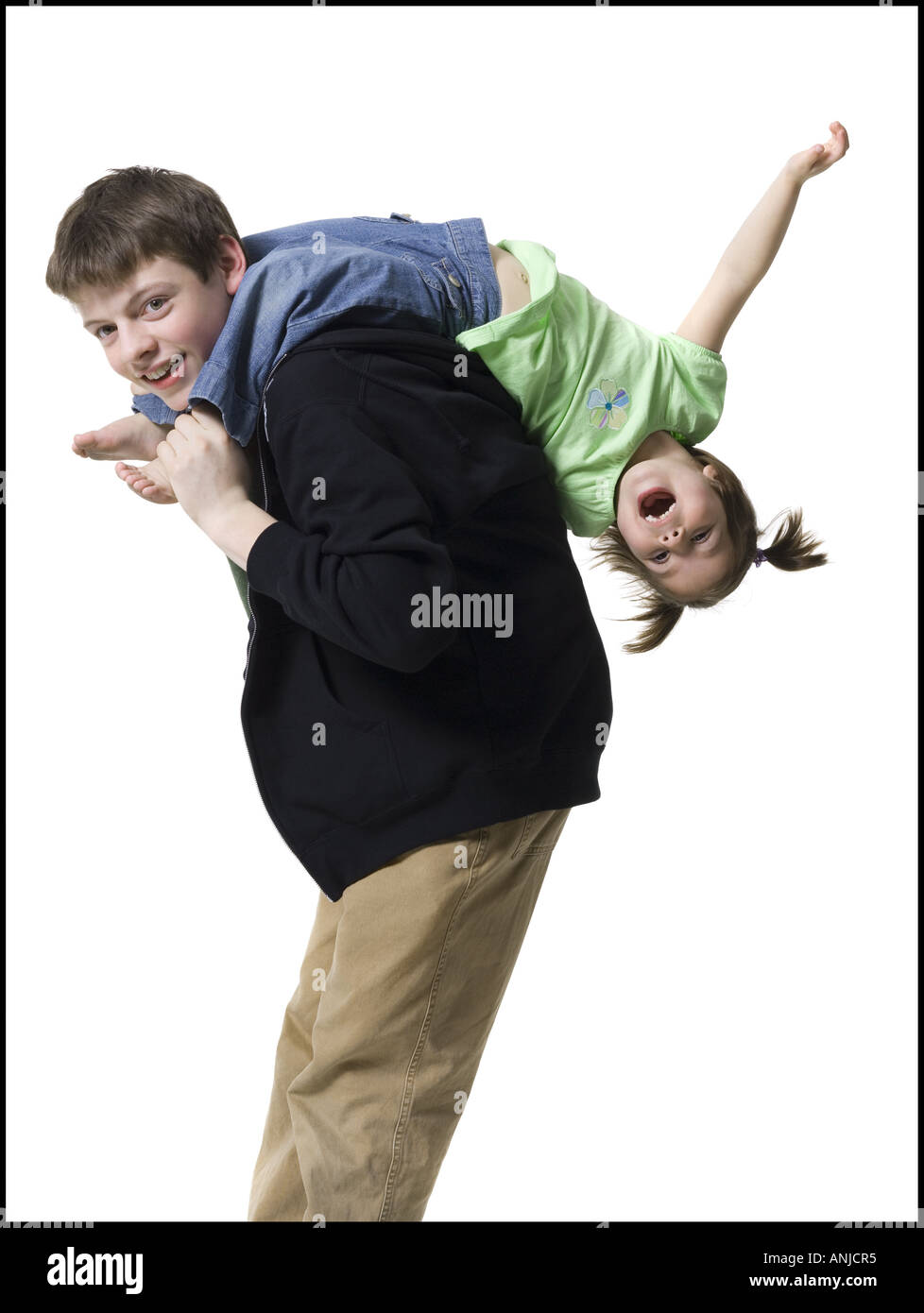 Profile of a brother carrying her sister on his shoulders Stock Photo ...