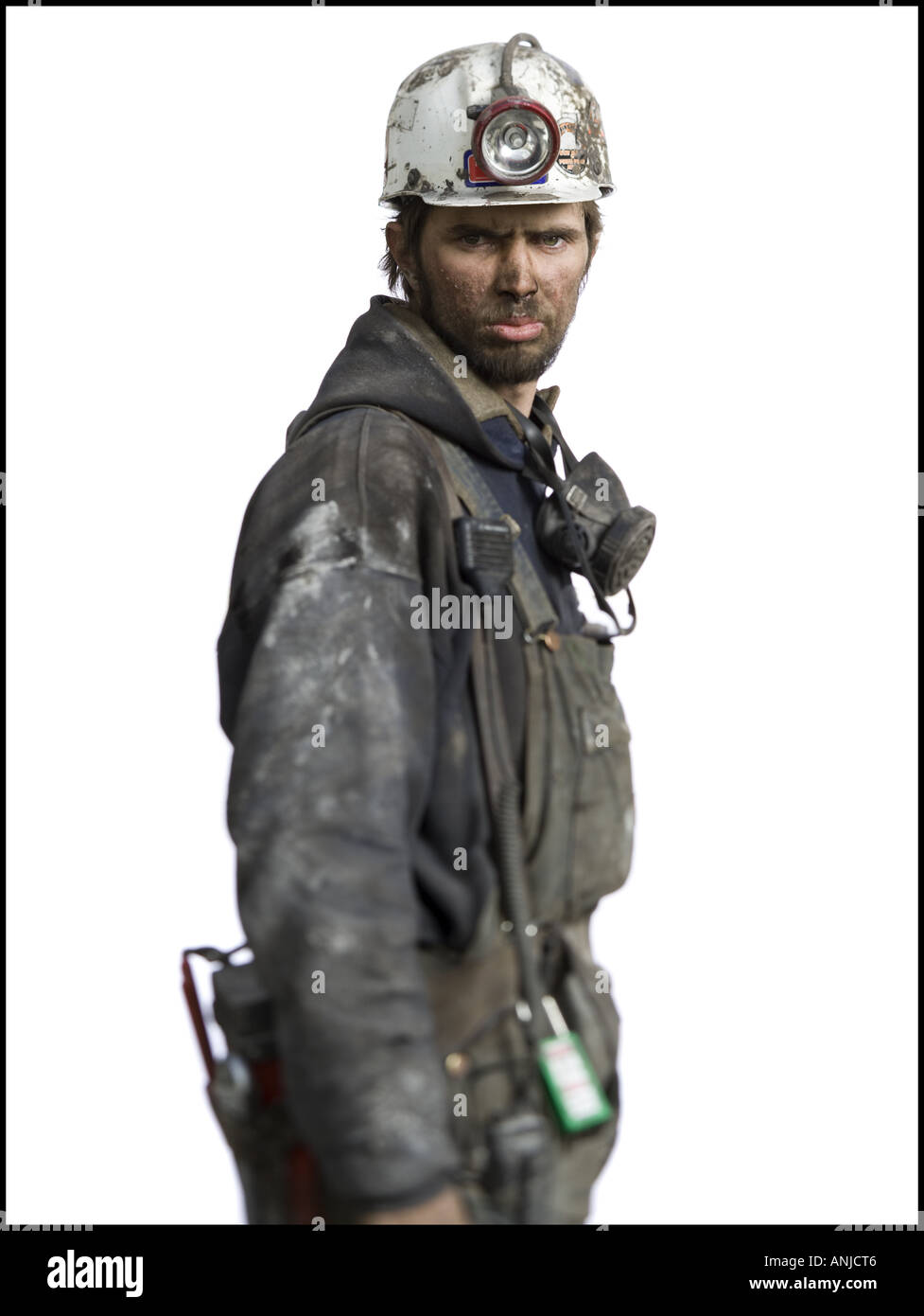 Profile of a miner wearing a hardhat with a headlamp Stock Photo - Alamy