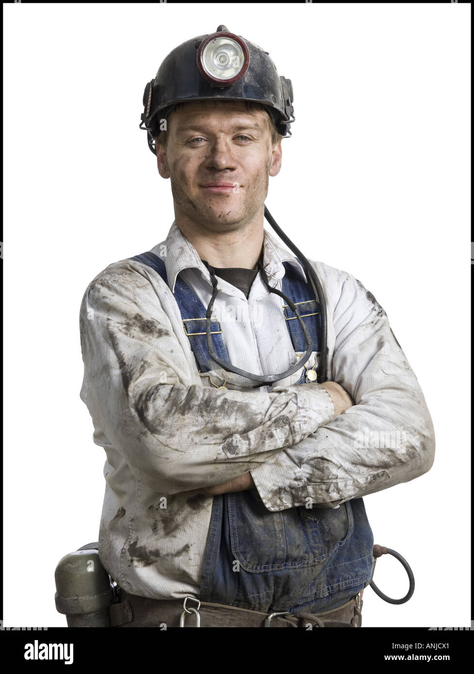 Portrait of a miner with his arms crossed Stock Photo - Alamy