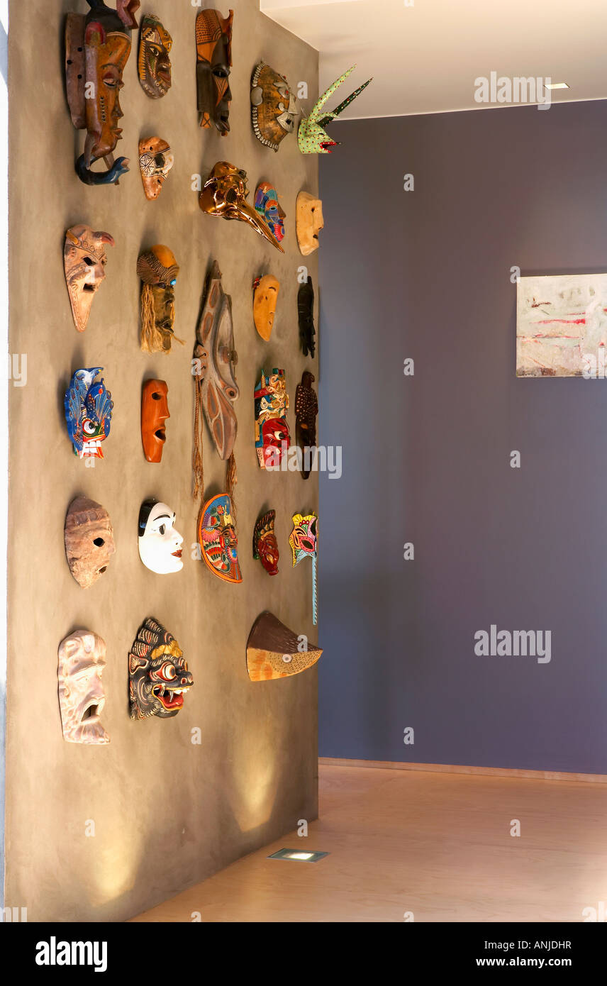 Colorful masks mounted on wall Stock Photo - Alamy