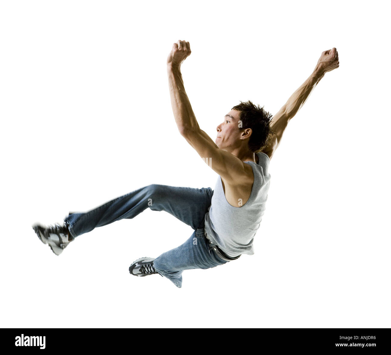 Profile of a young man jumping in mid air Stock Photo - Alamy