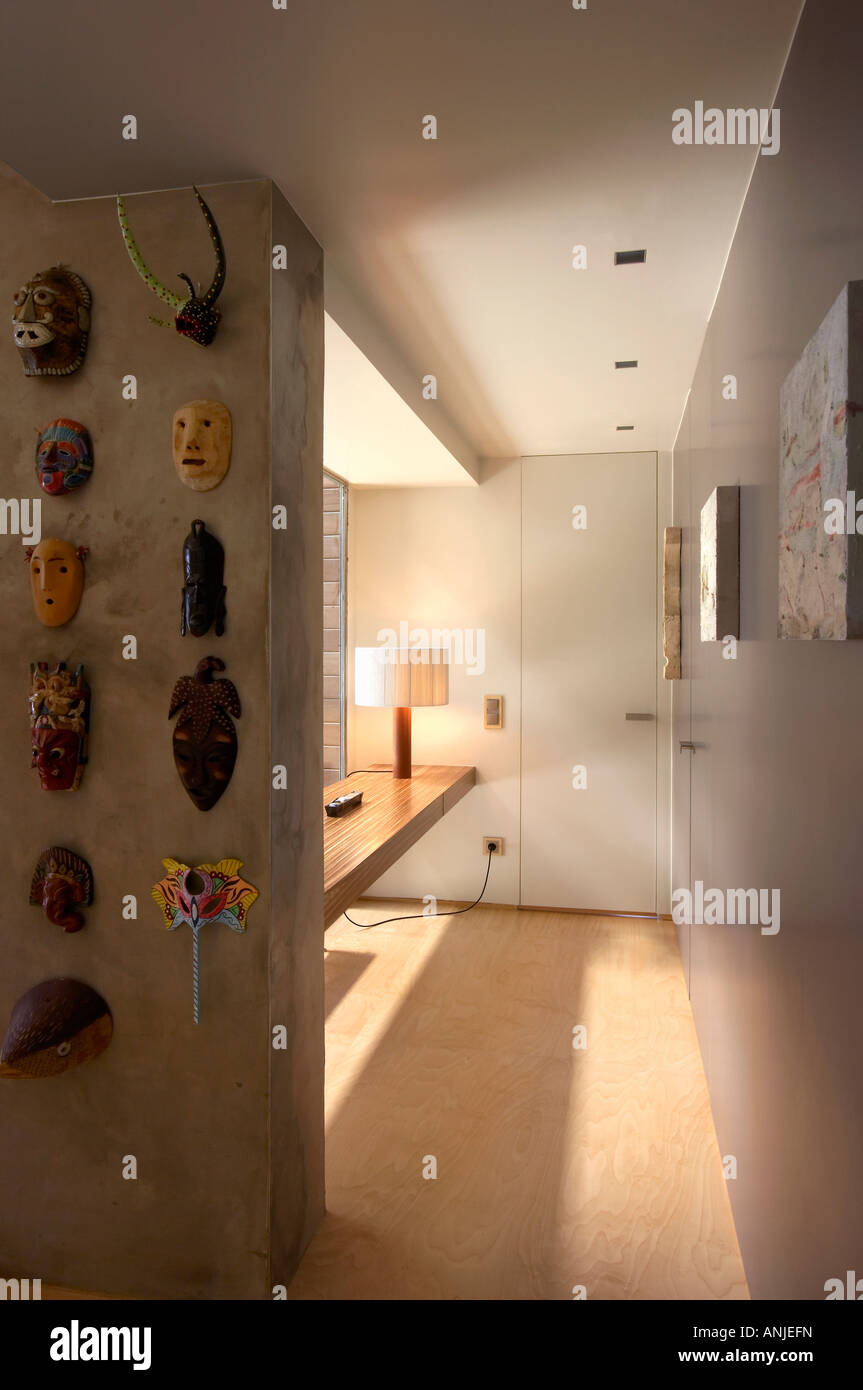 Mask mounted on wall with lamp and counter top in background Stock ...