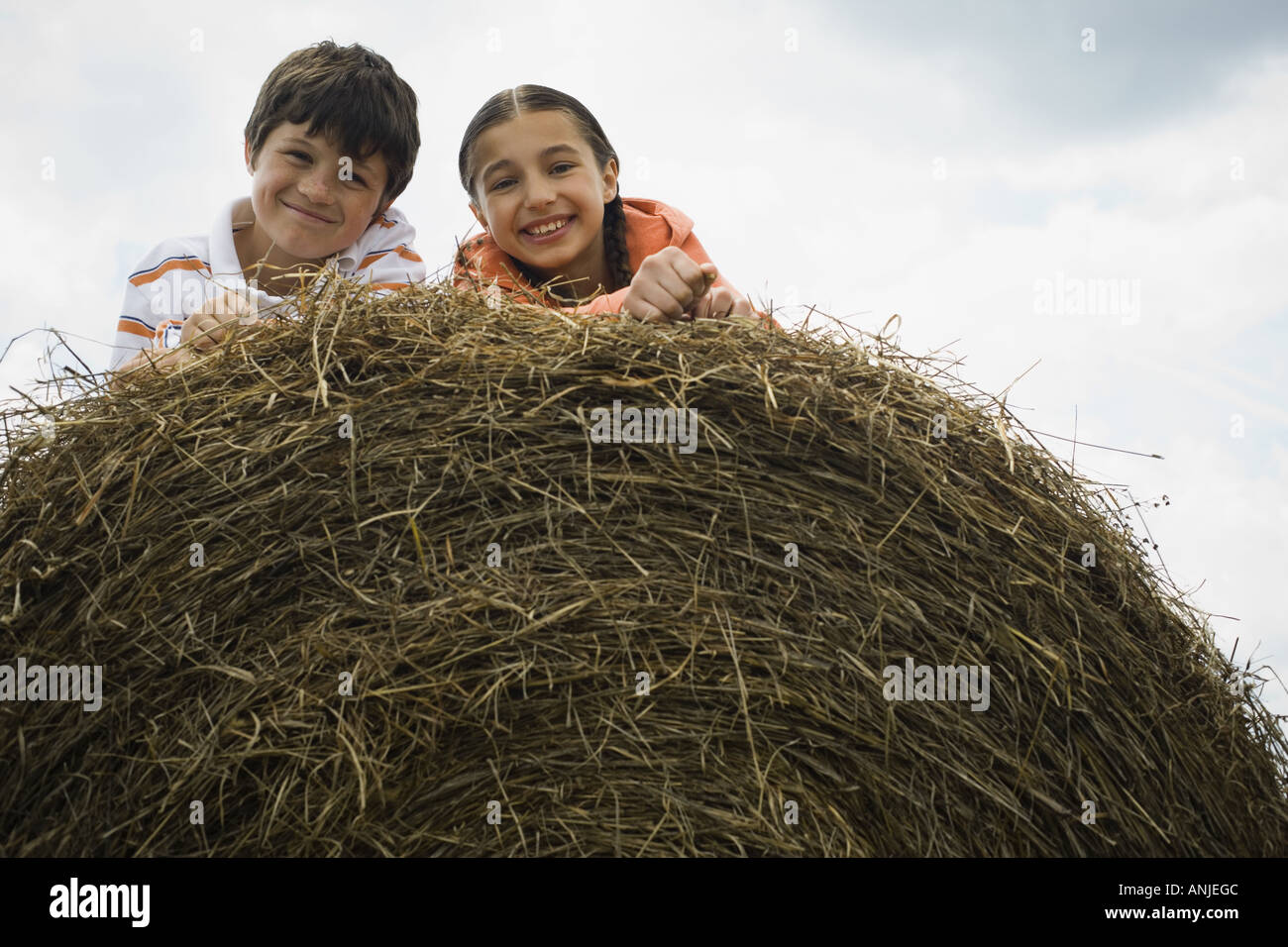 Girl lying on haystack hi-res stock photography and images - Alamy