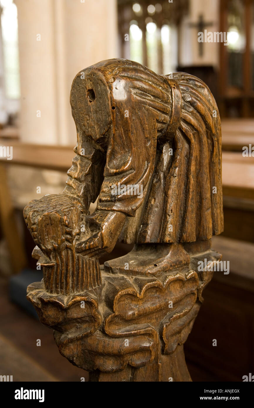 UK Suffolk Blythburgh village All Saints Church headless pew end figure ...