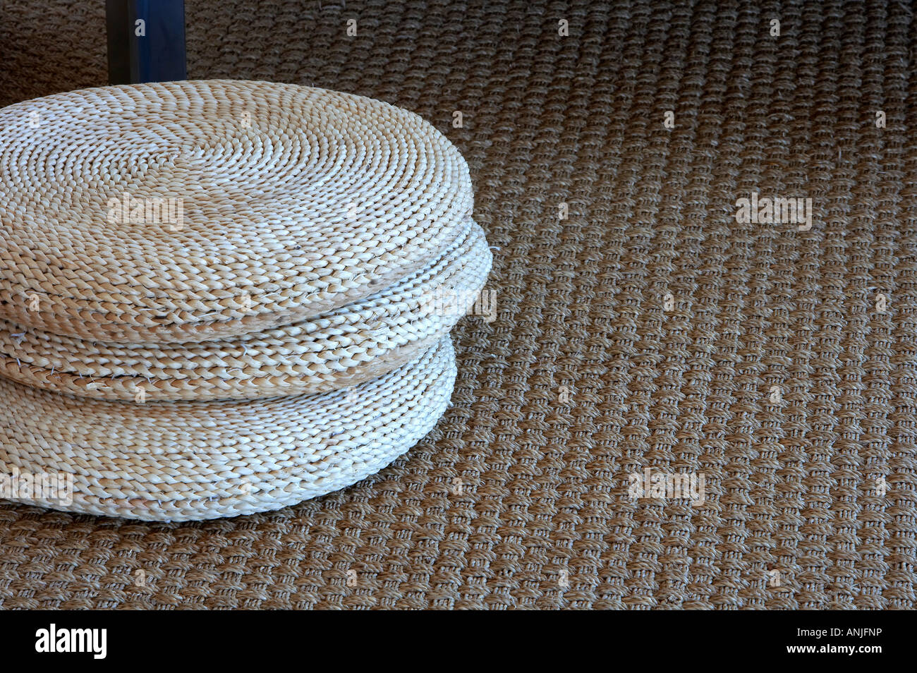 Wicker mat on carpet Stock Photo - Alamy
