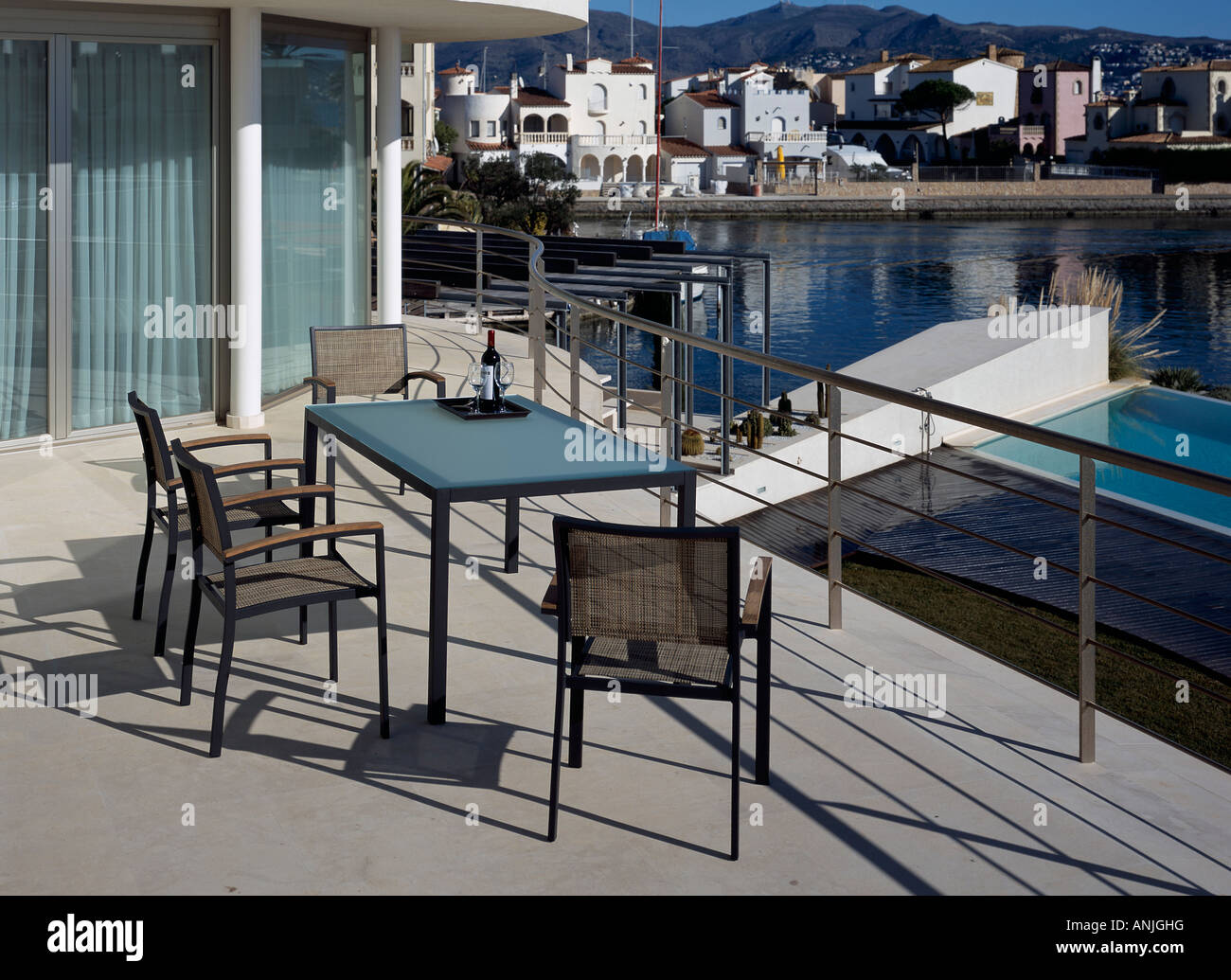 View of a table set out on a deck Stock Photo - Alamy