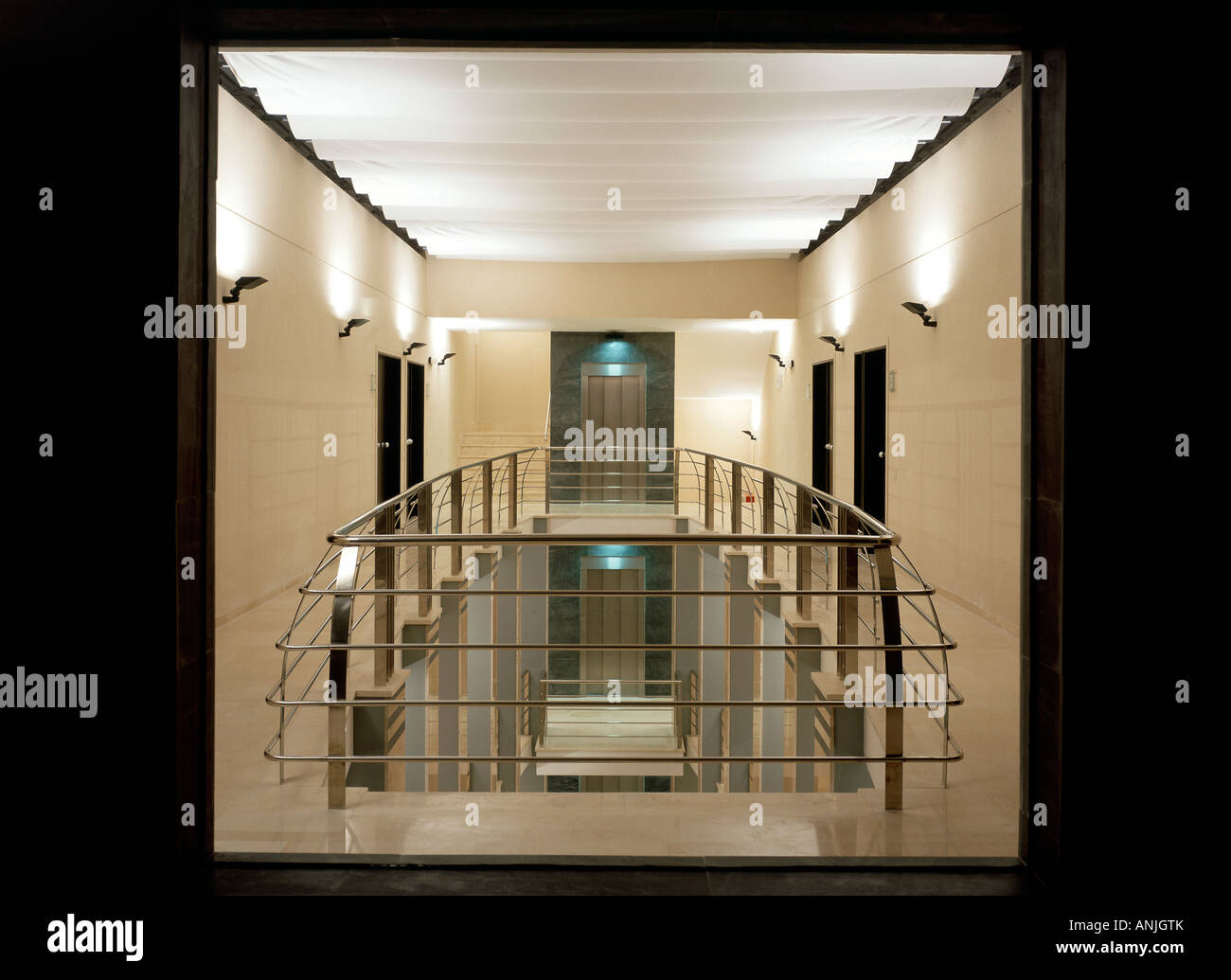 View of a corridor with a metallic railing Stock Photo - Alamy
